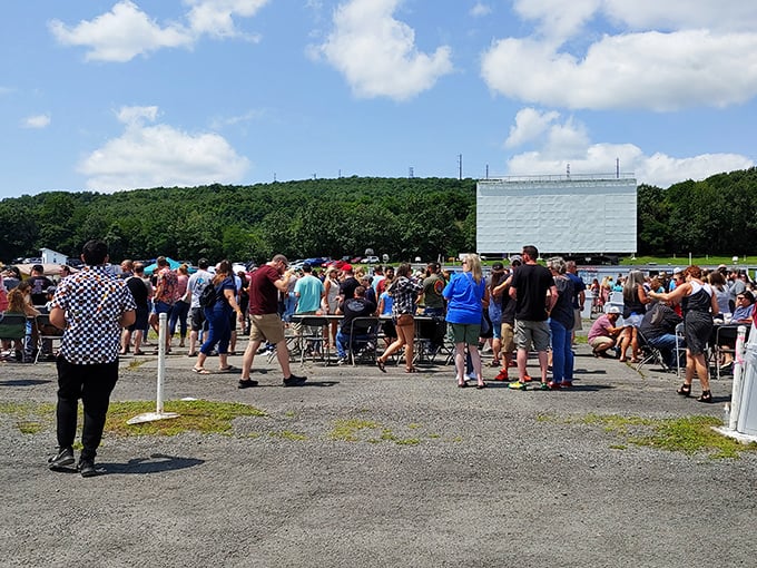 Sunday flea market crowds transform the Circle's grounds into a bustling marketplace, proving this landmark earns its keep even when the projector's off.