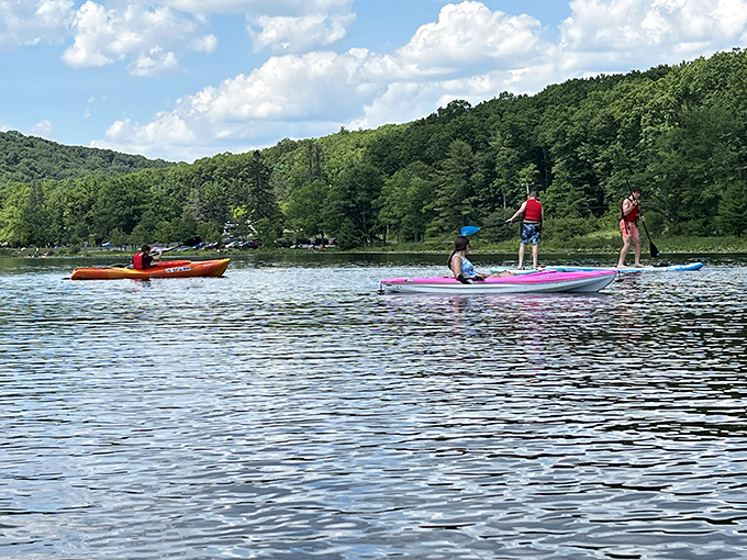 Paddleboarding and kayaking on amber waters—like gliding across liquid topaz while your office emails drown somewhere in the digital abyss.
