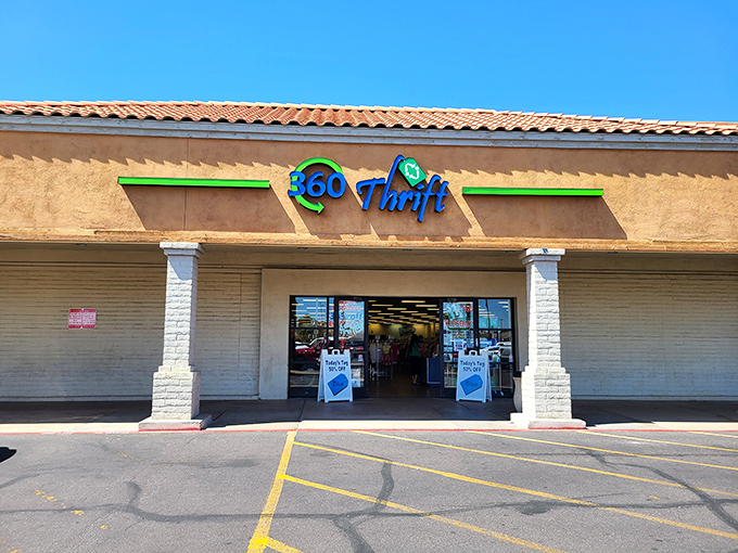 360 Thrift's vibrant blue and green sign pops against the desert backdrop—a recycling oasis.