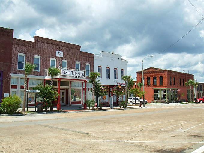 The Dixie Theatre anchors Apalachicola's main street like a beloved neighborhood storyteller, still spinning tales after all these years.