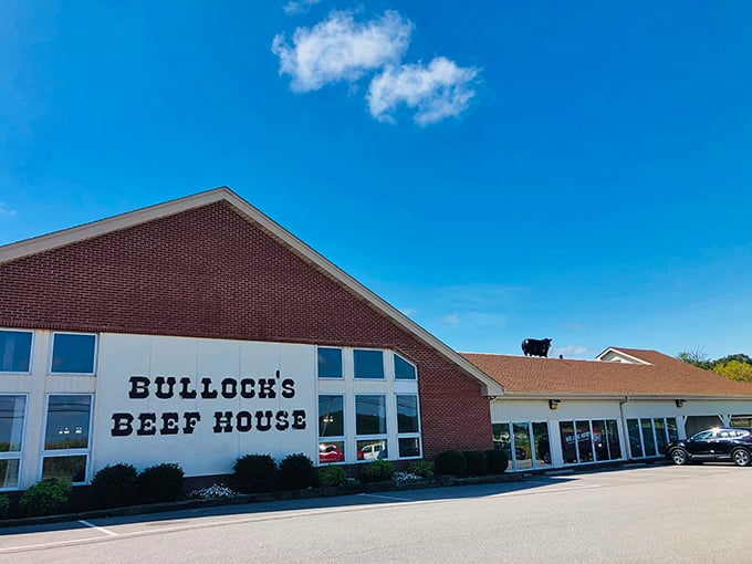 Bullock's Beef House stands proud against the blue sky, a temple to Maryland's pit beef tradition. That silhouette of a bull on the roof isn't just decoration—it's a promise.