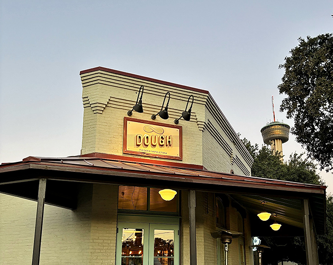 Dough's charming white brick building houses pizza perfection. This San Antonio gem elevates Neapolitan pizza without the attitude – just pure wood-fired bliss.