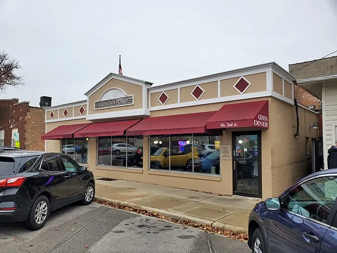 Geneva Diner's classic small-town charm shines through its simple, welcoming exterior. Red awnings signal the comfort food waiting inside.
