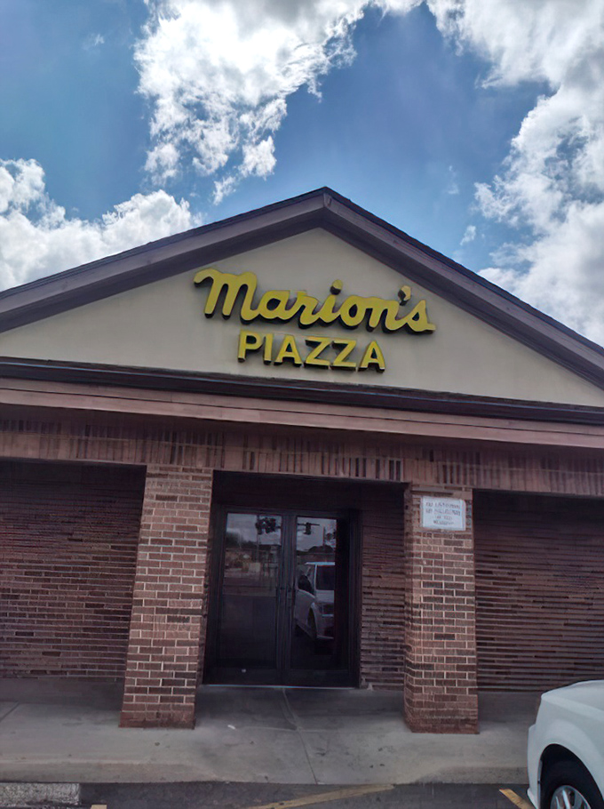 Marion's bright yellow sign beckons pizza lovers like a lighthouse. This Dayton institution knows thin-crust perfection is worth celebrating.