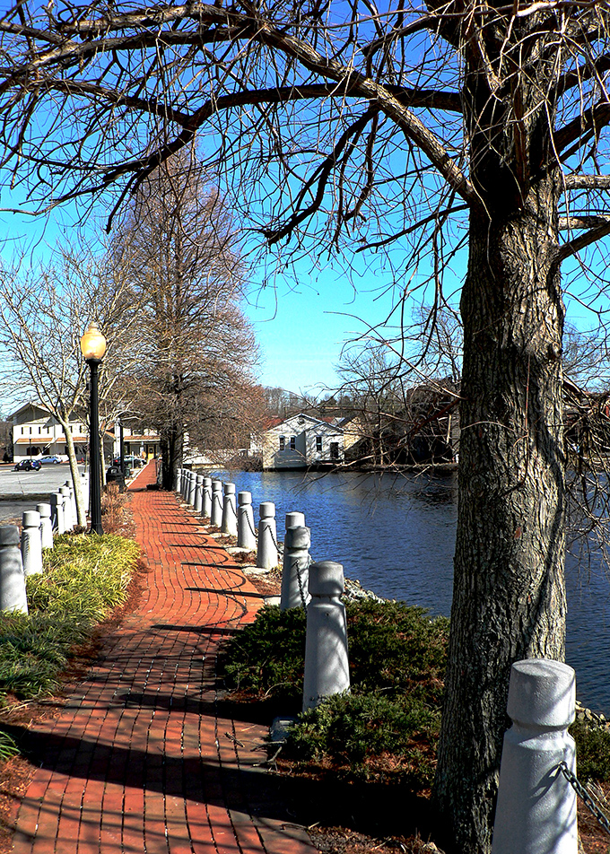 Milton's waterfront walkway offers that perfect evening stroll – just add an ice cream cone for peak small-town bliss.