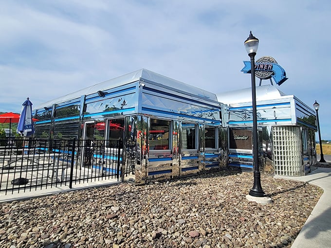 Pine Grove Diner shimmers in the sunlight – a chrome palace where breakfast dreams come true.