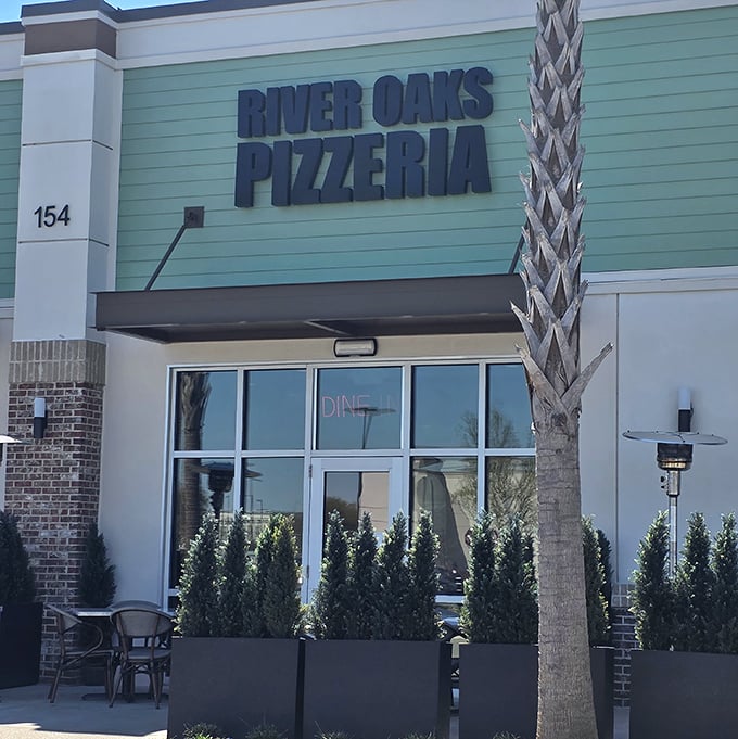 River Oaks Pizzeria's coastal-colored exterior fits perfectly in Myrtle Beach. Palm trees and pizza – a vacation for your taste buds.