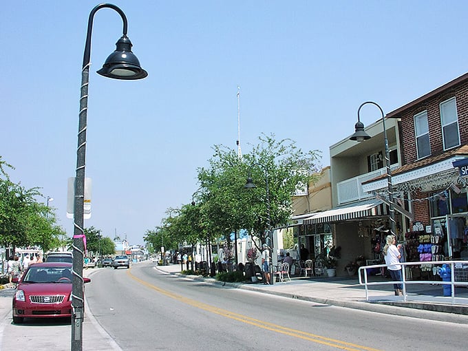 Tarpon Springs' lamp posts twist skyward like licorice sticks, guiding treasure hunters down streets where every storefront whispers "come inside!"