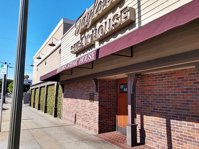 Taylor's brick facade and neon glow scream classic American steakhouse – old-school dining at its finest.