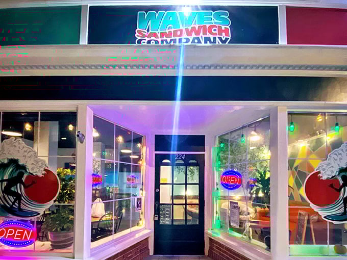 Waves' neon glow promises sandwich salvation after dark. The kind of place that makes you wonder why you ever settled for drive-thru sandwiches.