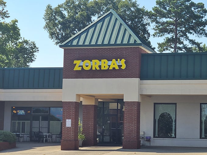 Zorba's bright yellow sign promises Greek hospitality with an unexpected pizza twist – a culinary plot twist worth discovering.