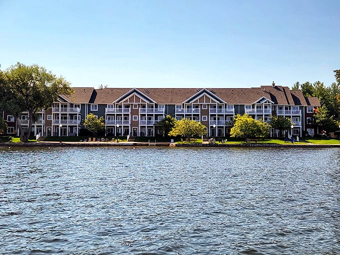Fall colors frame waterfront condos along Cadillac's shoreline – front-row seats to Michigan's most spectacular seasonal show.