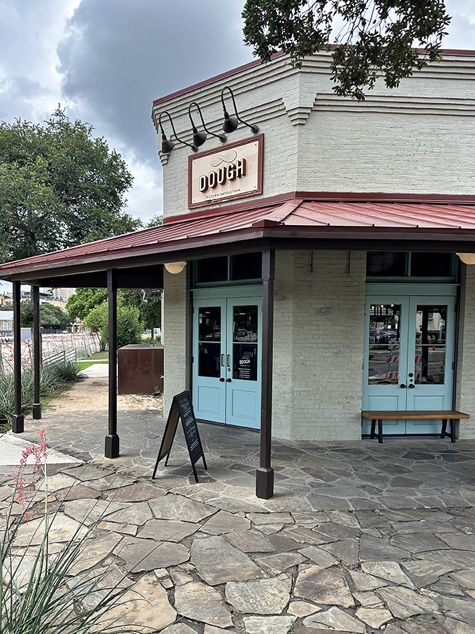 Those mint doors lead to pizza paradise! Dough's rustic-chic exterior hints at the authentic Neapolitan magic happening inside this San Antonio favorite.