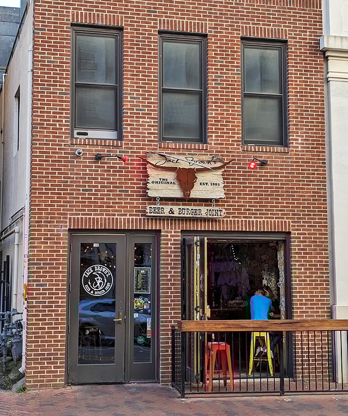 Jack Brown's brick façade and open-air window create the perfect burger joint vibe. Where conversations flow as freely as the craft beer.