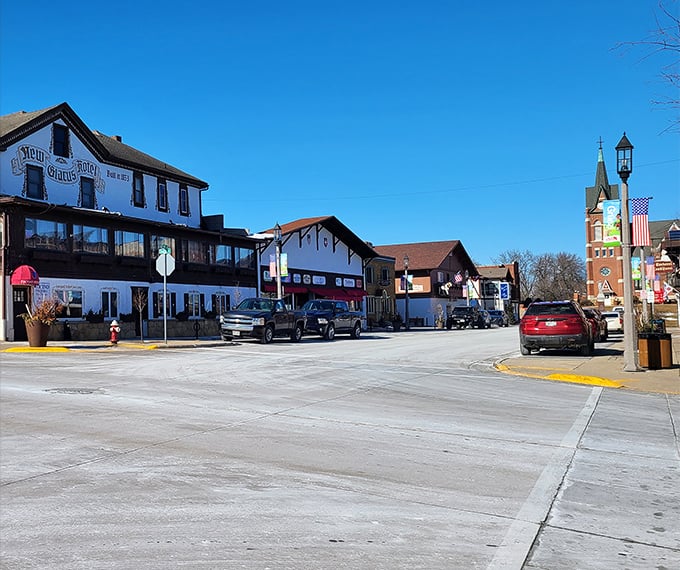 A picturesque view of downtown captures Swiss-inspired charm, local shops, and bright skies, creating the perfect small-town Wisconsin experience.