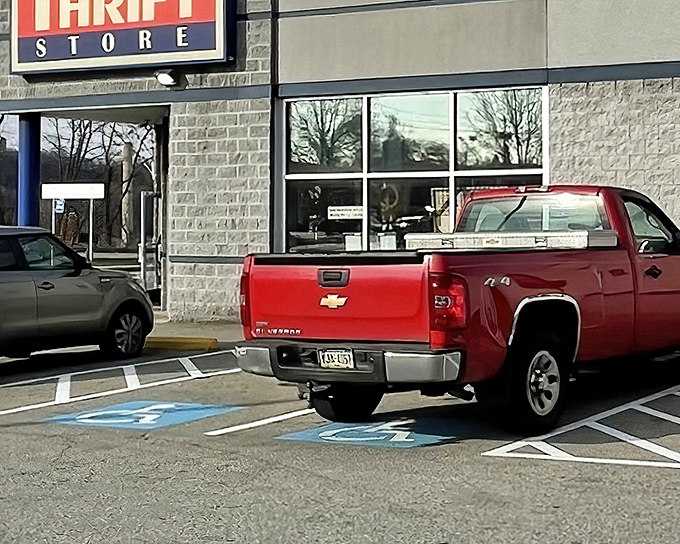 That red truck isn't just parked—it's delivering someone's castoffs that will become another shopper's treasure by afternoon.