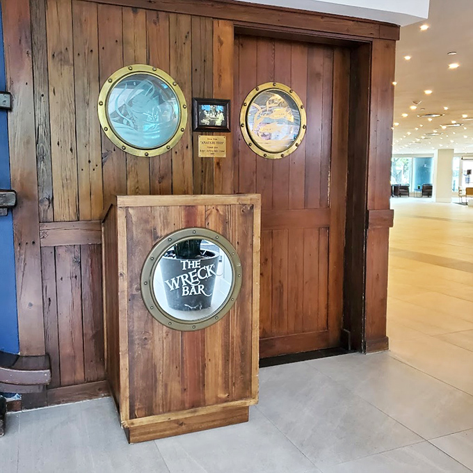 Porthole windows and nautical details create the perfect backdrop for the bar's famous underwater mermaid shows.