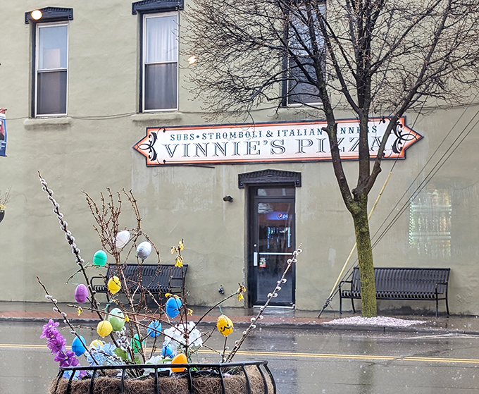 The classic storefront sign tells you everything you need to know – Vinnie's means business about pizza.