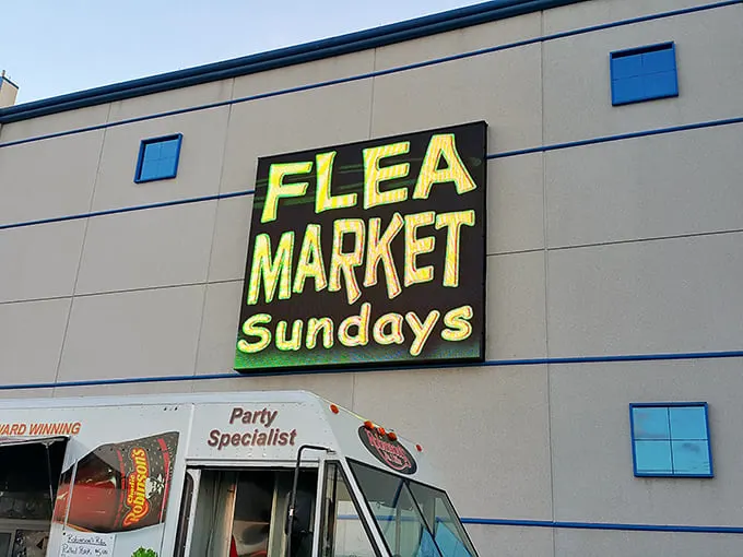 That electric green sign isn't just bright—it's a beacon for Sunday treasure hunters. Like Times Square for the bargain-obsessed!