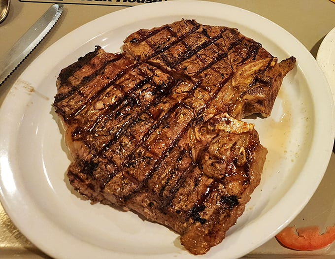 This T-bone isn't just a steak—it's a declaration of carnivorous intent, with grill marks so perfect they could win a geometry competition.