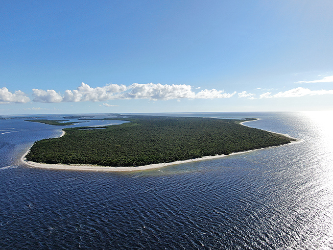The ultimate bird's-eye view reveals Cayo Costa's true isolation. An emerald jewel set in azure waters, untouched by development's reach.