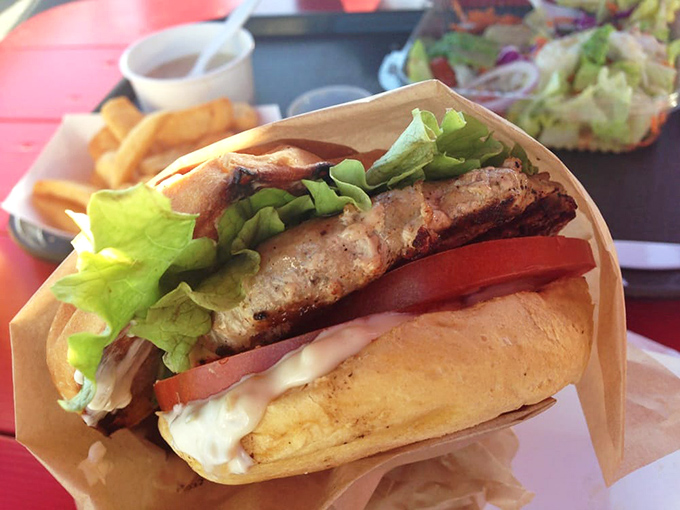 The Ahi Tuna Burger—where steak meets sea. Fresh tuna grilled to perfection, nestled in a pillowy bun with all the fixings.