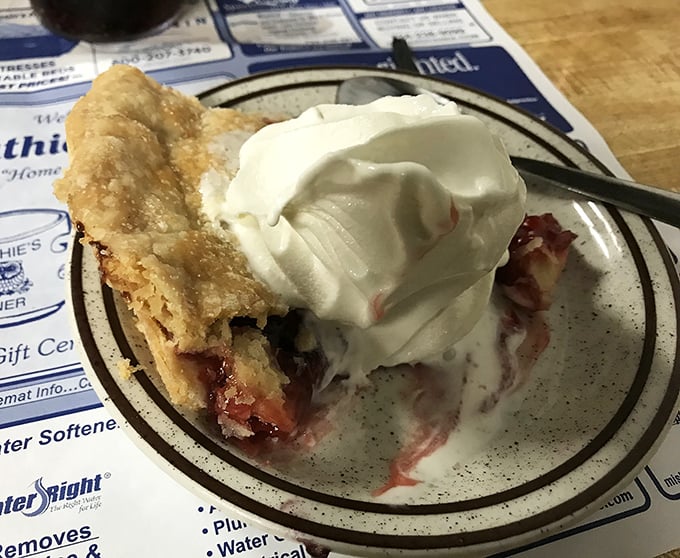 Homemade apple pie topped with whipped cream – because sometimes dessert for breakfast is absolutely the right choice.