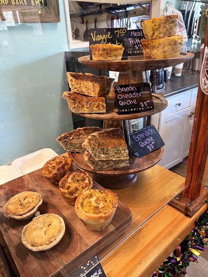 A three-tiered display of quiche perfection—each slice promising a different adventure in flavor country.