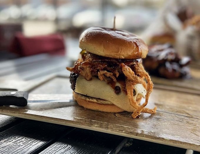This isn't just a burger with crispy onions—it's architecture. A delicious, precarious tower that dares you to figure out how to eat it.