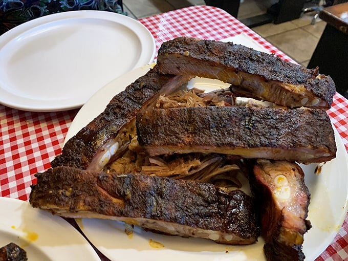 These ribs don't need a fancy introduction – that smoke ring and bark speak volumes about the low-and-slow philosophy that transforms tough meat into tender magnificence.