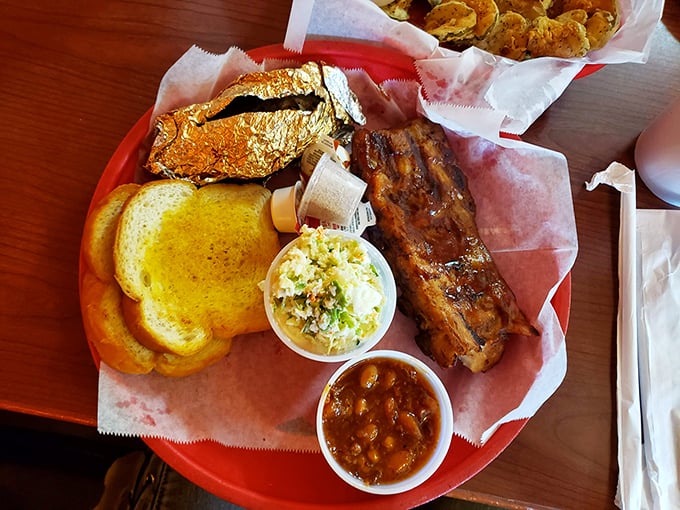 Baby back ribs, coleslaw, and those legendary beans—the holy trinity of barbecue that makes grown adults weak in the knees.