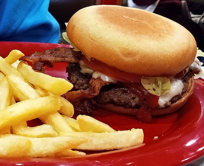 The bacon cheeseburger arrives like a beautiful, beefy monument to American excess—exactly as it should be.