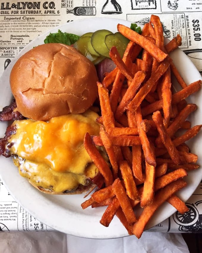 This isn't just a cheeseburger—it's a masterclass in American classics. Melty cheese, perfectly charred patty, and sweet potato fries that'll make you forget regular potatoes exist.