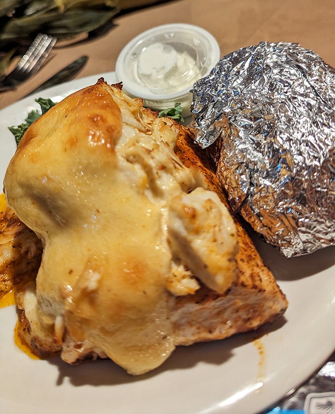 A loaded baked potato that's dressed for success, melting with cheese and ready to complement those seafood treasures.