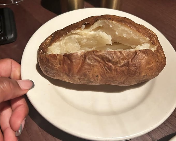 The humble baked potato, elevated to art form. Split it open and watch the steam rise like a love letter to simplicity.