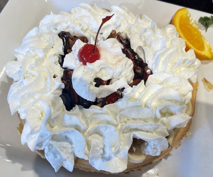 Whipped cream mountains surrounding a cherry-topped volcano of sweetness. Dessert masquerading as breakfast is the ultimate adult freedom.