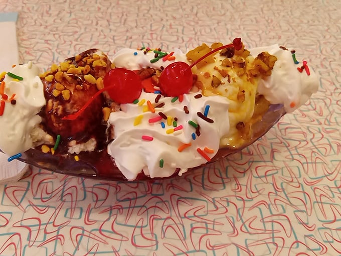 This banana split isn't just dessert—it's a carnival of joy with whipped cream mountains and sprinkle confetti. Calories don't count when something looks this festive.