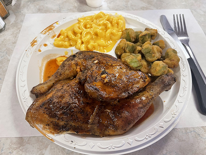Barbecue chicken with that perfect smoke ring, sided with mac and cheese that's unapologetically orange and hush puppies fried to golden perfection.