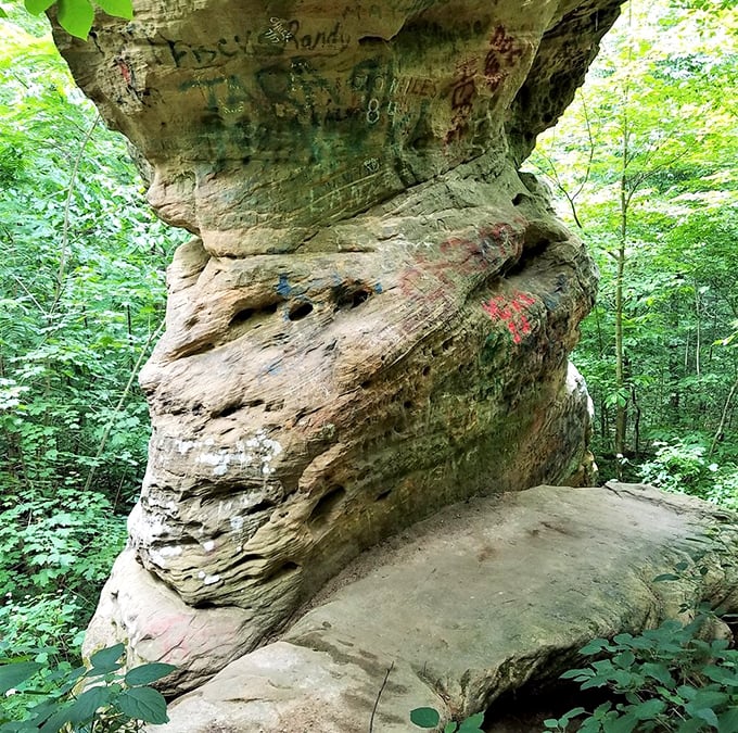 Graffiti meets geology where visitors couldn't resist leaving their mark. Mother Nature sighs and continues her much slower artwork on this ancient canvas.