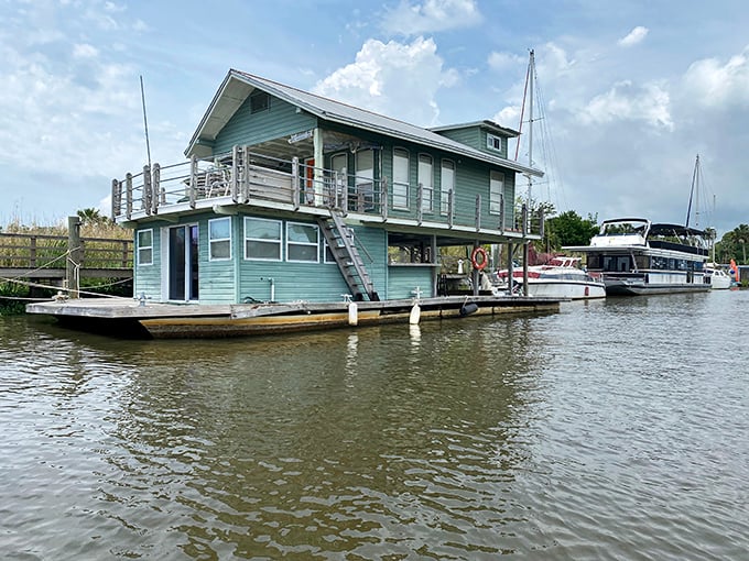 Houseboats along the waterfront offer a glimpse into the ultimate Florida dream – waking up with water lapping gently beneath your bedroom floor.