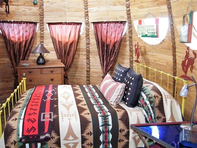 Sweet dreams are guaranteed when your bedroom looks like it was decorated by artistic forest spirits.