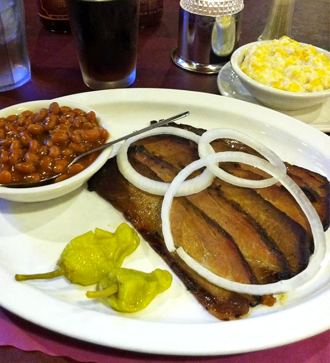 Beef brisket so tender it surrenders to your fork without a fight – pure barbecue bliss.