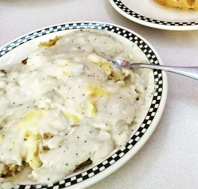 Biscuits and gravy: where pepper-flecked white gravy cascades over hidden treasures like a delicious Indiana version of Niagara Falls.