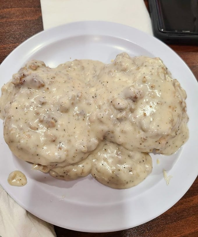 Biscuits drowning in sausage gravy - comfort food therapy that your grandmother would absolutely approve of.