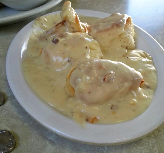 These biscuits and gravy aren't just a meal—they're an edible hug. The pepper-speckled cream sauce blankets everything in velvety comfort.