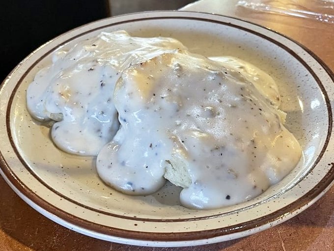 Biscuits swimming in creamy pepper-flecked gravy—the kind of breakfast that makes you understand why people write country songs about going home.