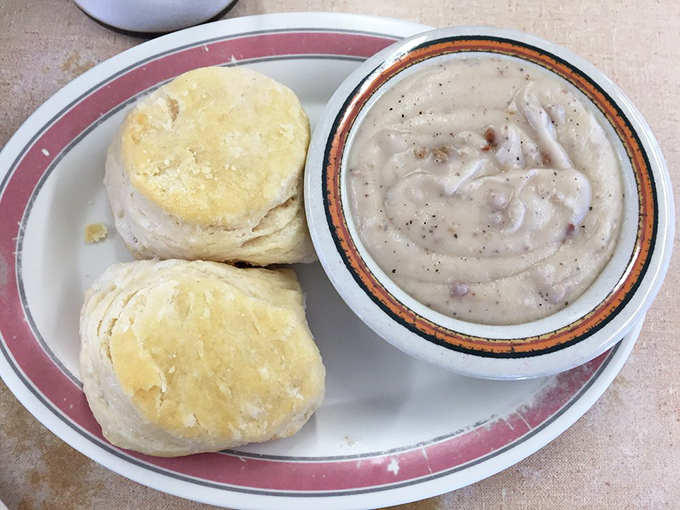 Biscuits and gravy—the ultimate comfort food marriage. These fluffy clouds swimming in peppery cream gravy could reconcile any family feud.