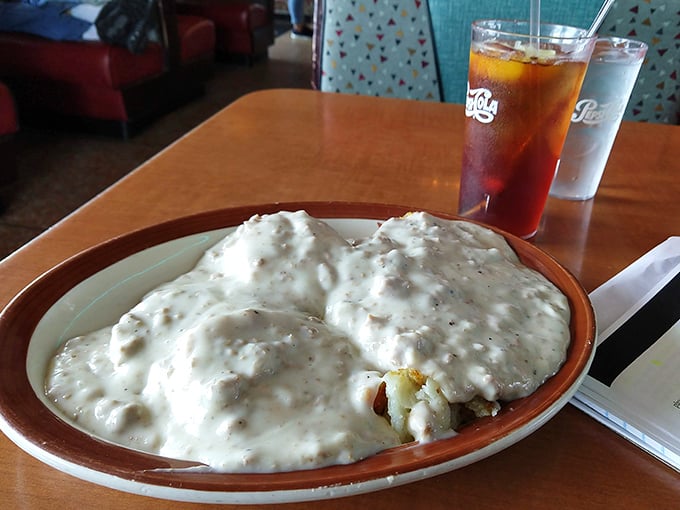 Biscuits and gravy so generously portioned they've practically annexed the entire plate. This isn't a side dish – it's a lifestyle choice.
