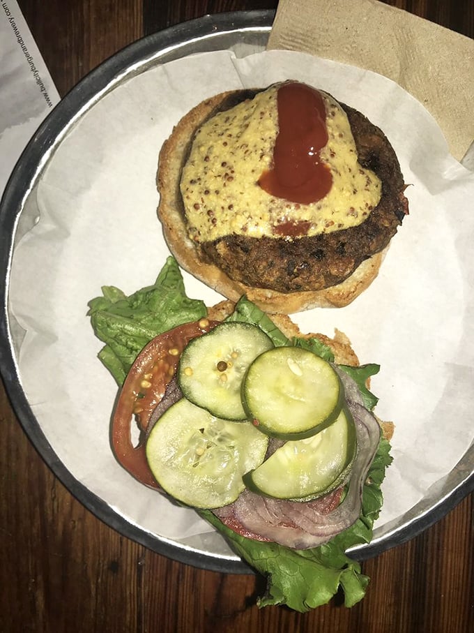 The deconstructed burger approach—patty on one side, garden-fresh toppings on the other—creates a choose-your-own-adventure meal that's as fun to assemble as it is to devour.