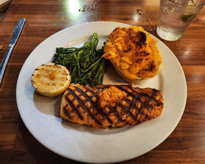 Blackened fish that's actually moist inside? It's not culinary fiction—it's Rock'n Fish's perfectly grilled halibut with a side of mac and cheese that would make your grandmother jealous.